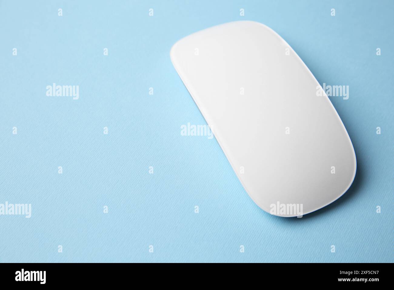 One wireless mouse on light blue background. Space for text Stock Photo ...