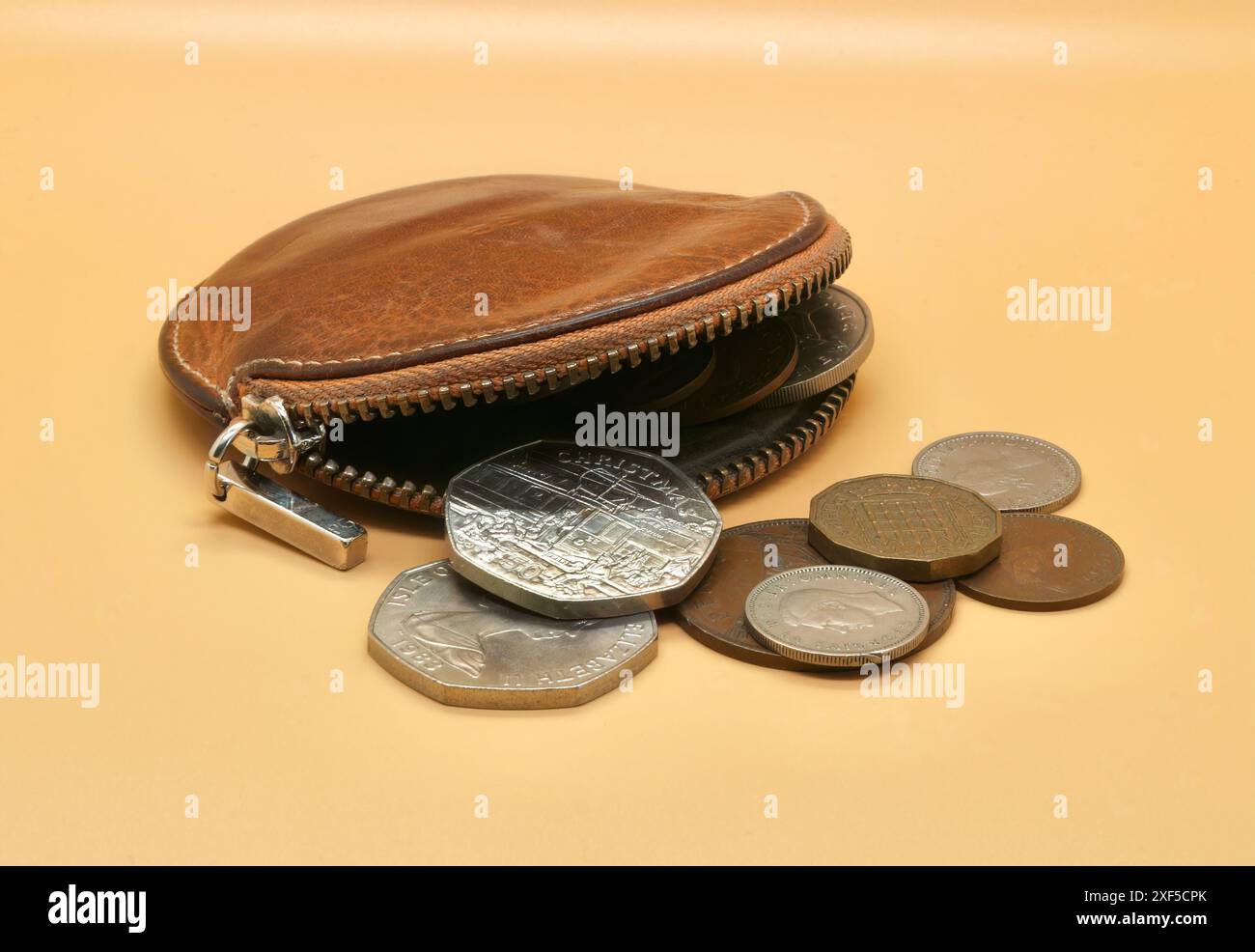 Photo of an open leather zip purse with a collection of UK coins small ...