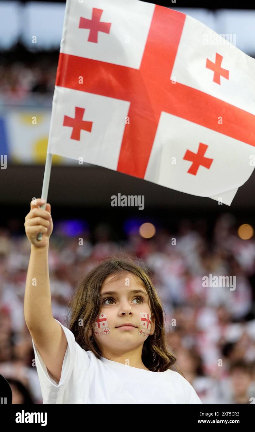 A young Georgia fan holding a flag during the UEFA Euro 2024, round of ...