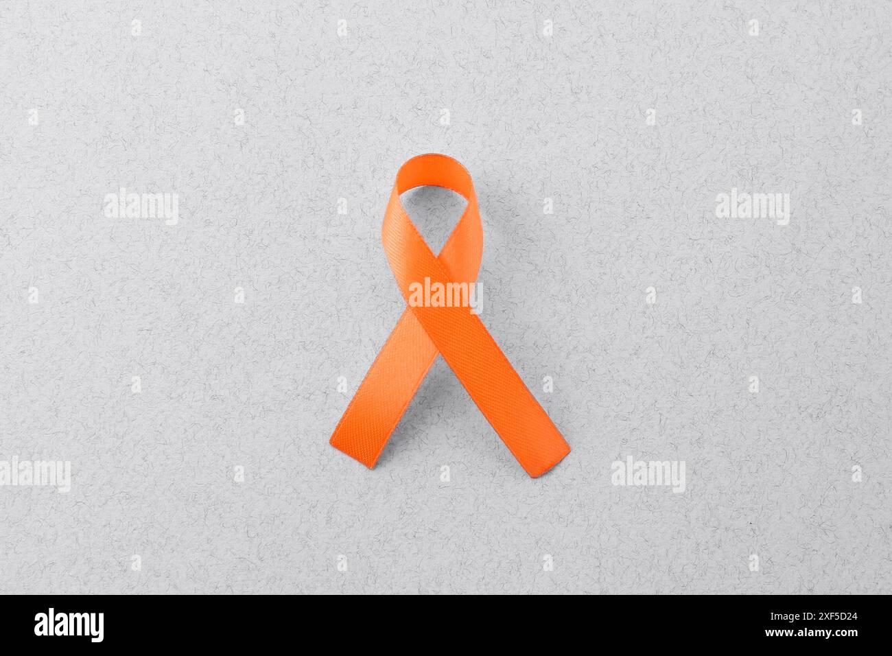 Orange awareness ribbon on gray background, top view Stock Photo - Alamy