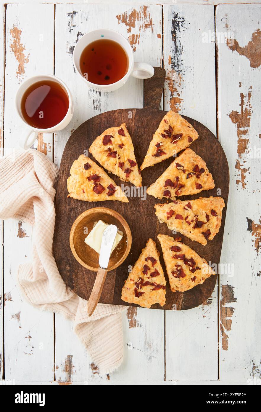 English scones. Freshly baking scones with sprinkles of cheddar and ...