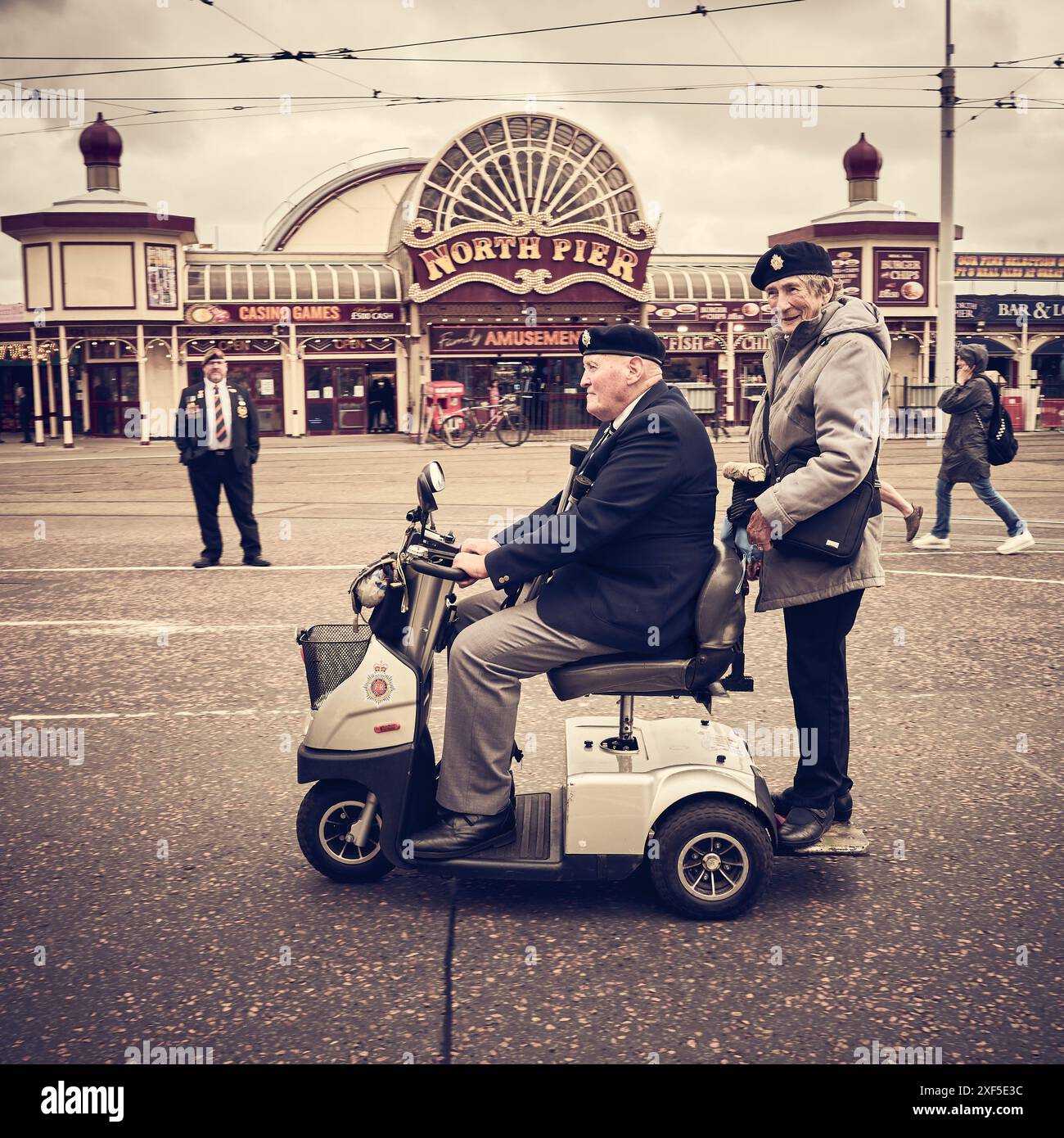 Two veterans on a mobility scooter during the Armed Forces week march ...