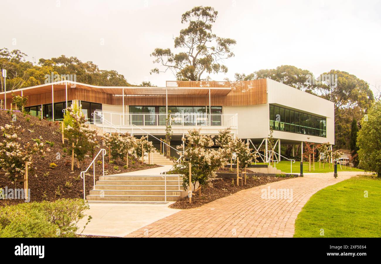 The exterior design of a building with beautiful, lush garden in the ...