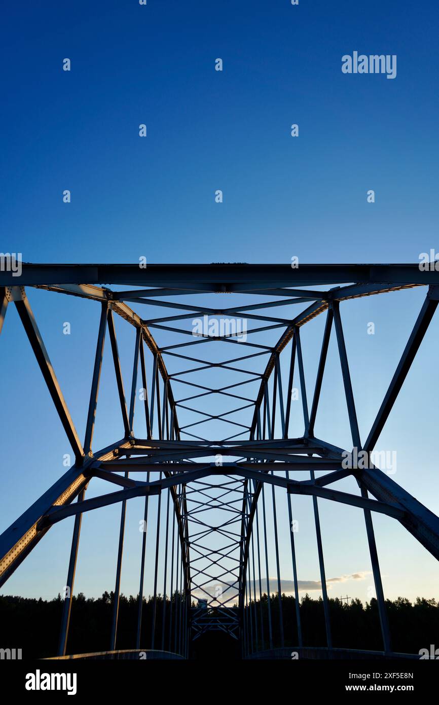 The steel girder structure of the old Oresund Bridge against blue clear ...