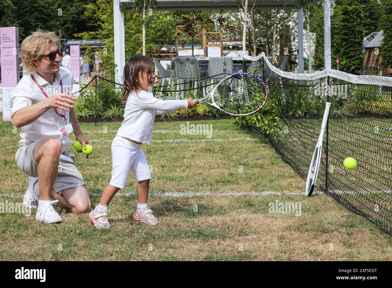 London, UK. 01st July, 2024. Sophia, 3 enjoys a game of tennis with her ...