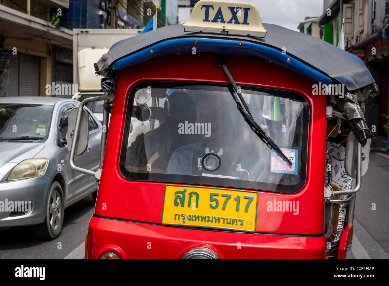 Bangkok, Thailand. 25th June, 2024. A close-up of an electric Tuk-Tuk, seen driving along ...