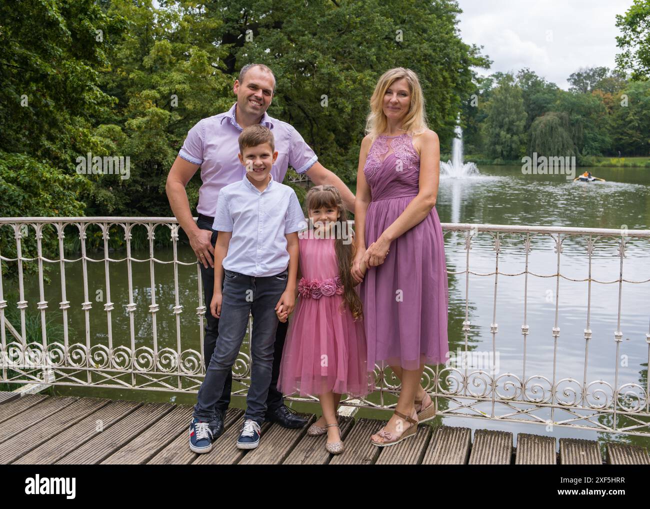 Portrait of a happy family. Laughing dad and mom, teenage son and first ...