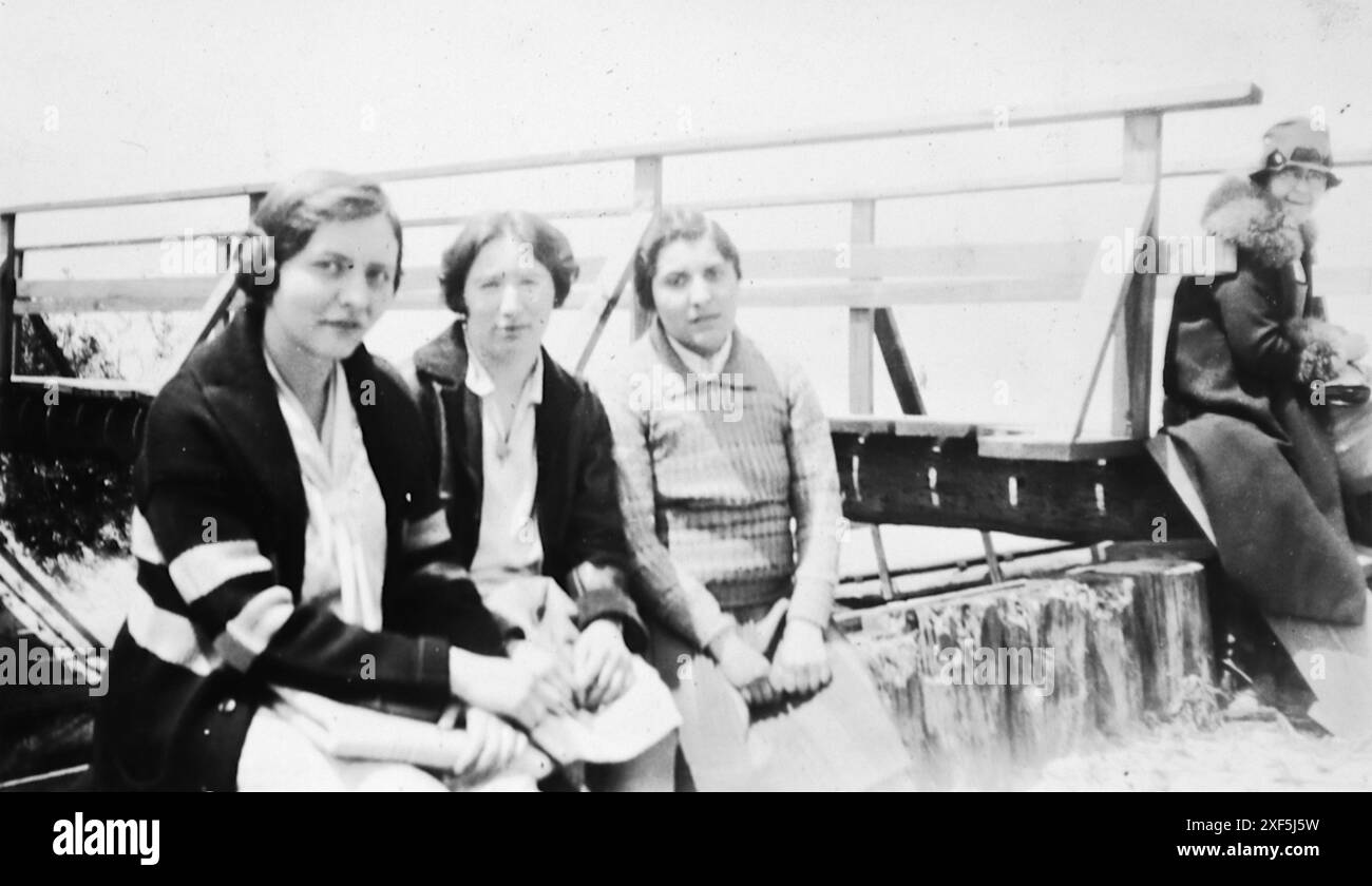 Fashion: A group of ladies beside a wooden footbridge, Lake Michigan ...