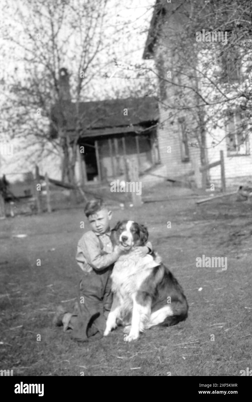 Fashion: A boy with a dog on a homestead, Chicago, 1920s. From a ...
