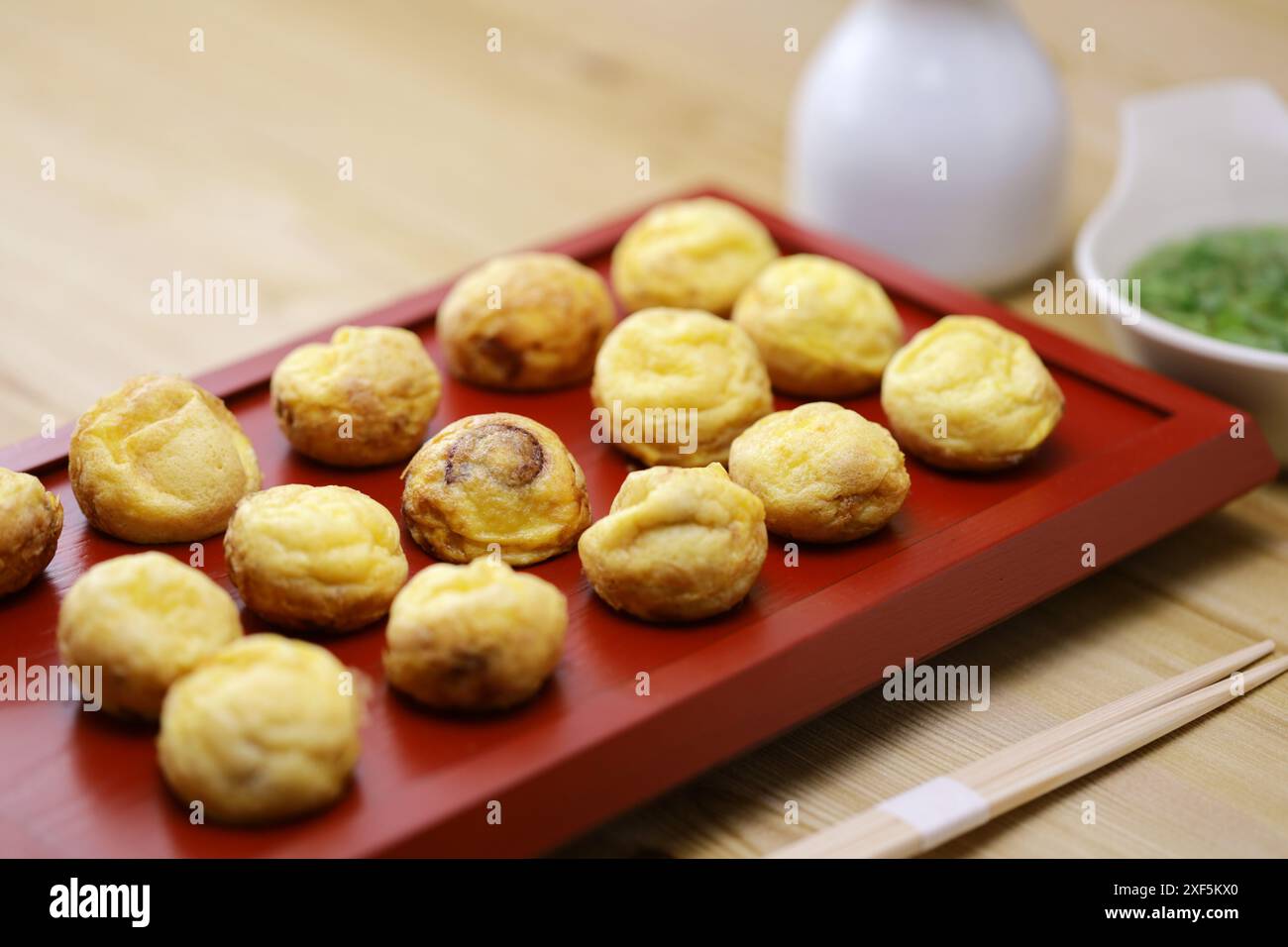 Homemade Akashiyaki (the origin of takoyaki) is round dumplings made of ...