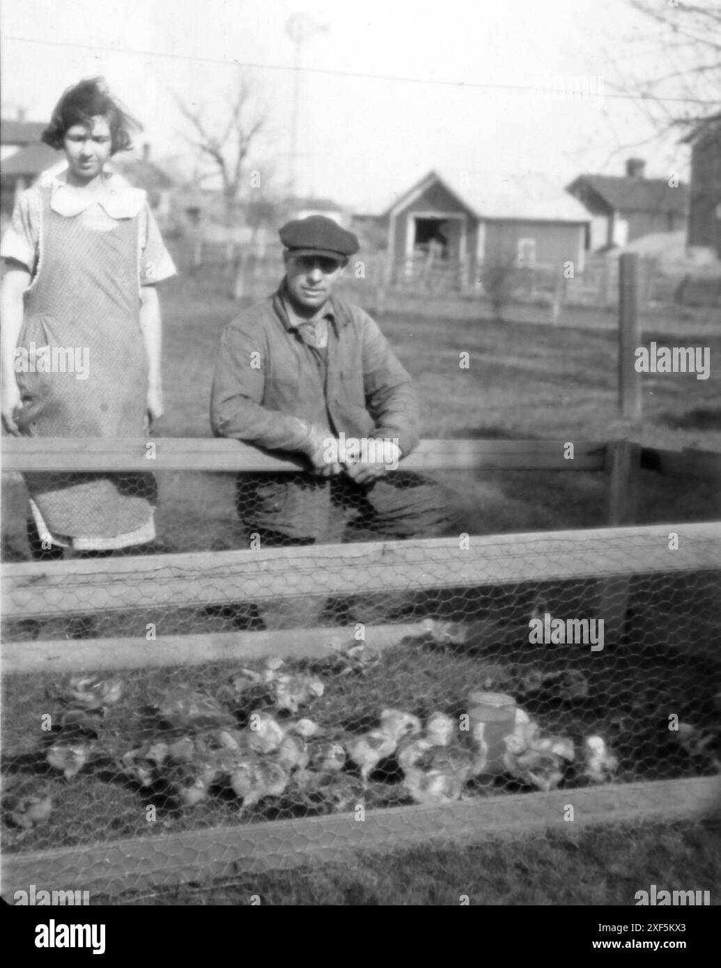 A man and woman on a homestead beside a chicken coop, Chicago 1920s ...