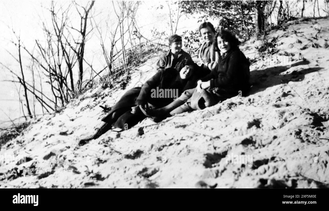 Fashion: A group of four university students on a sandy bank, Lake ...