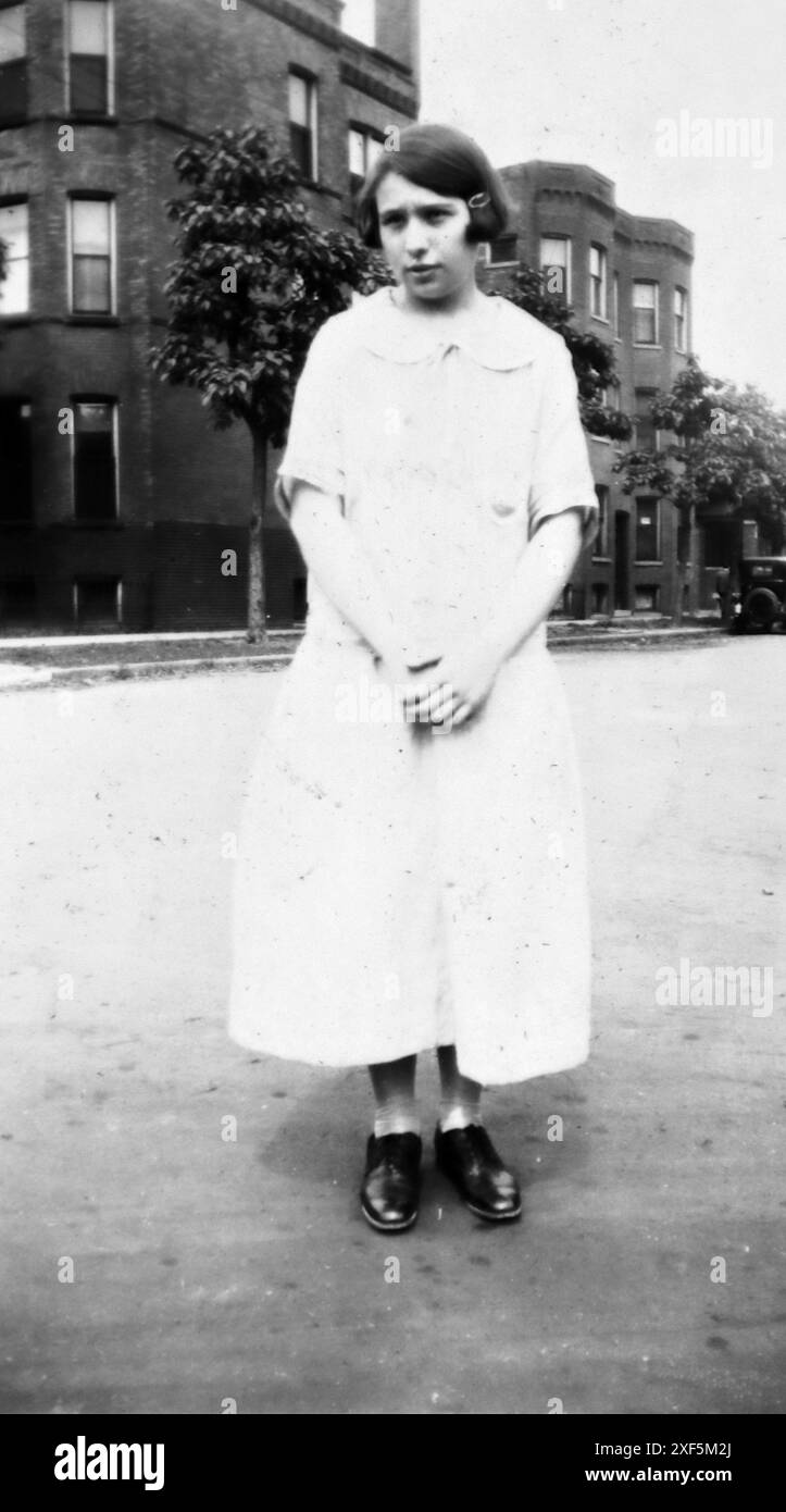 Fashion: Portrait of a young lady in a white dress. USA. 1920. From a ...