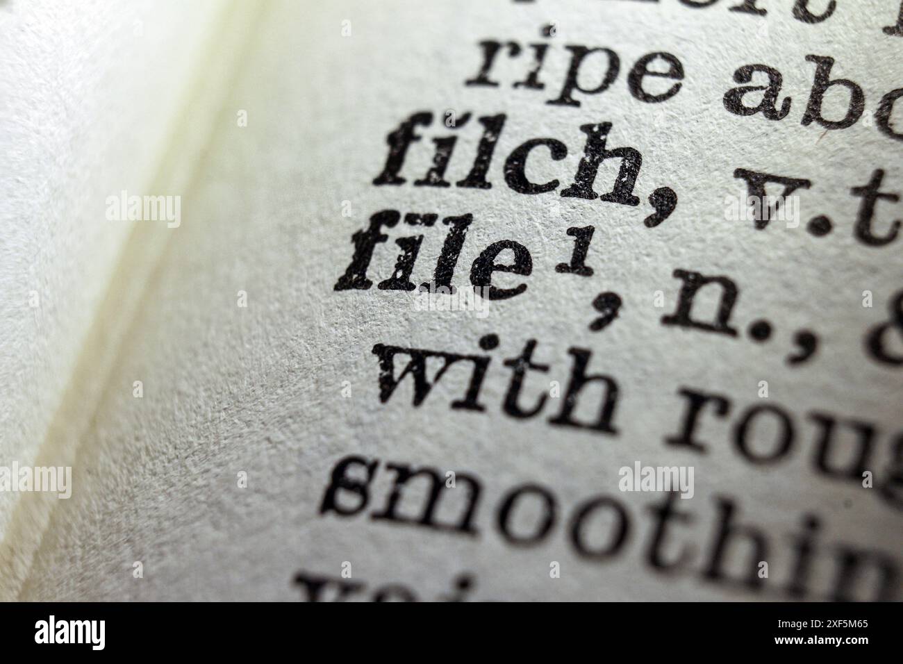 Word file on dictionary page, macro close-up Stock Photo - Alamy