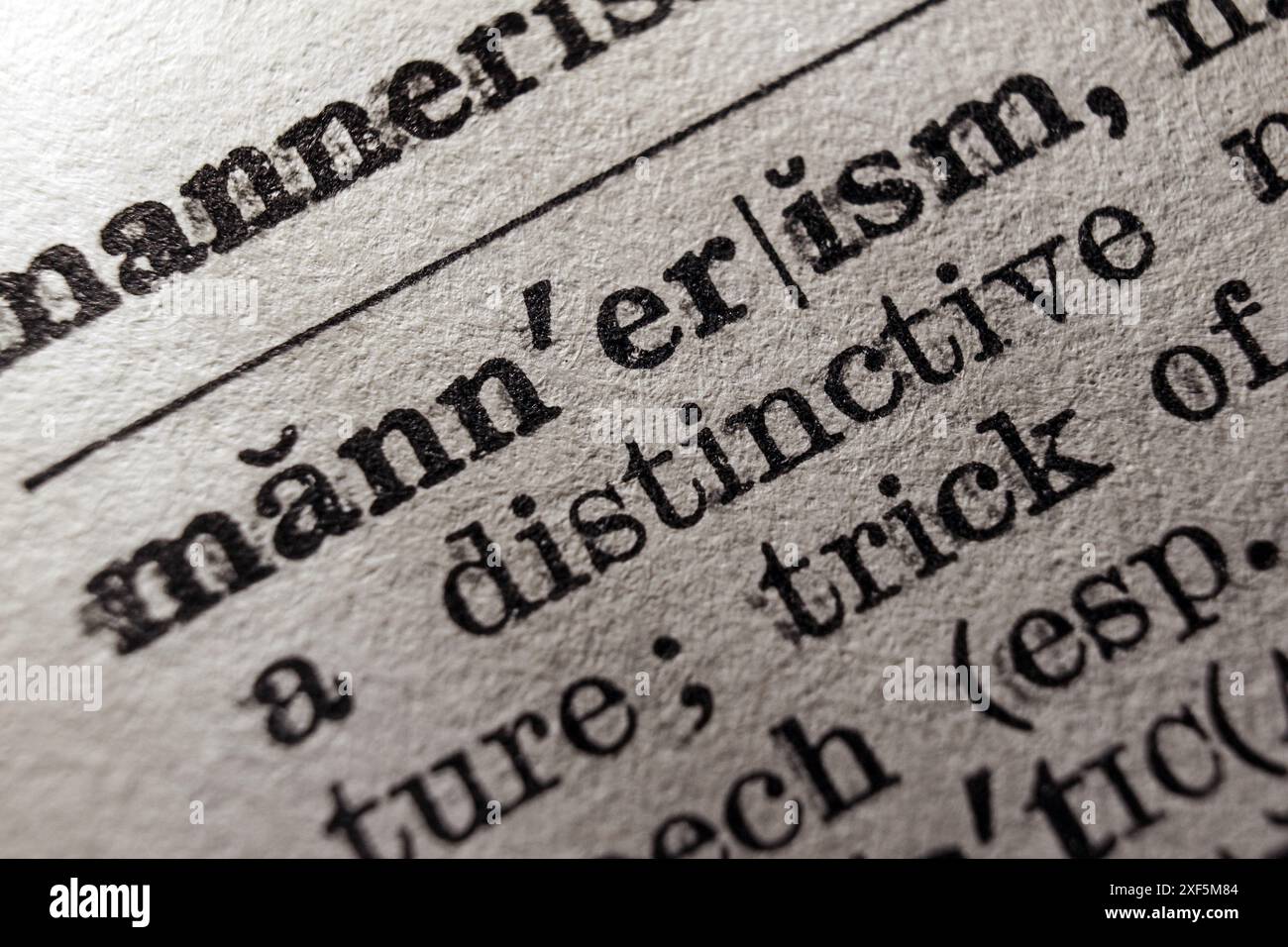 Word mannerism on dictionary page, macro close-up Stock Photo - Alamy