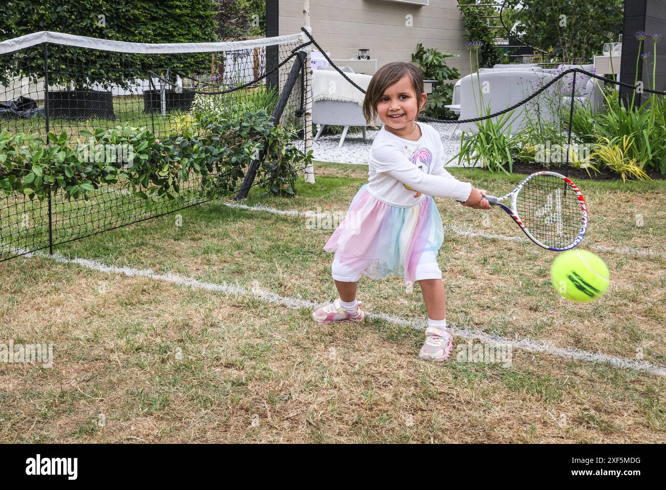 London, UK. 01st July, 2024. Sophia, 3 enjoys a game of tennis with her ...