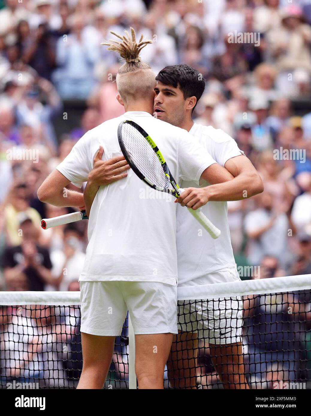 Carlos Alcaraz and Mark Lajal (left) after their match on day one of ...
