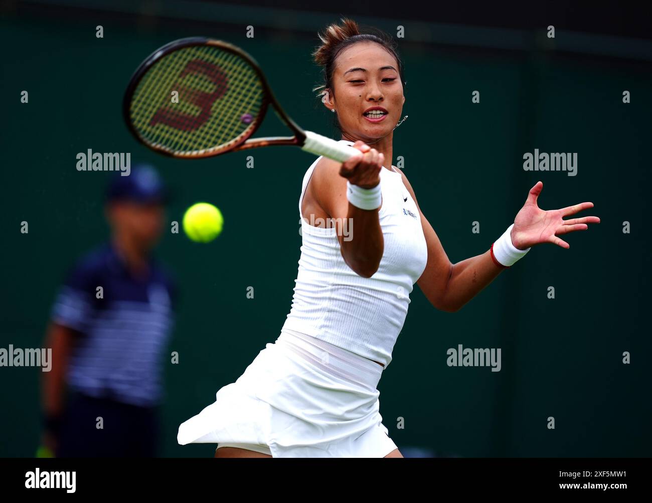 Qinwen Zheng in action against Lulu Sun (not pictured) on day one of ...