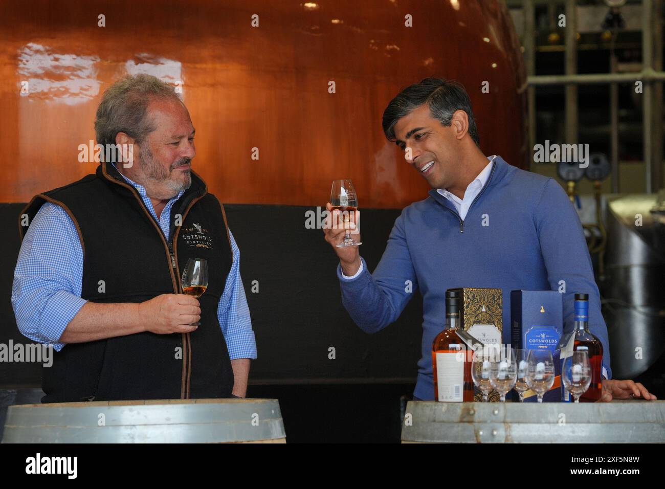 Prime Minister Rishi Sunak looks at a single malt whisky with Daniel ...