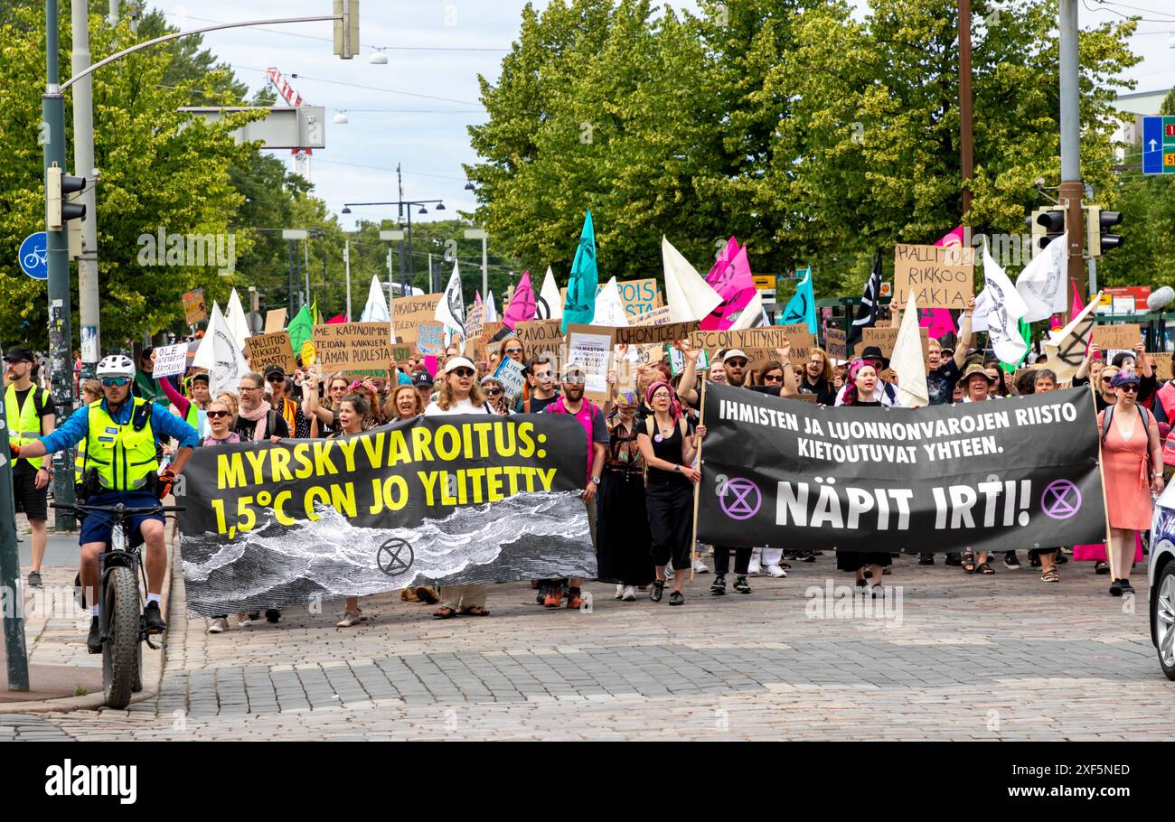 ‘Storm warning’ protest held by Extinction Rebellion Finland marching ...