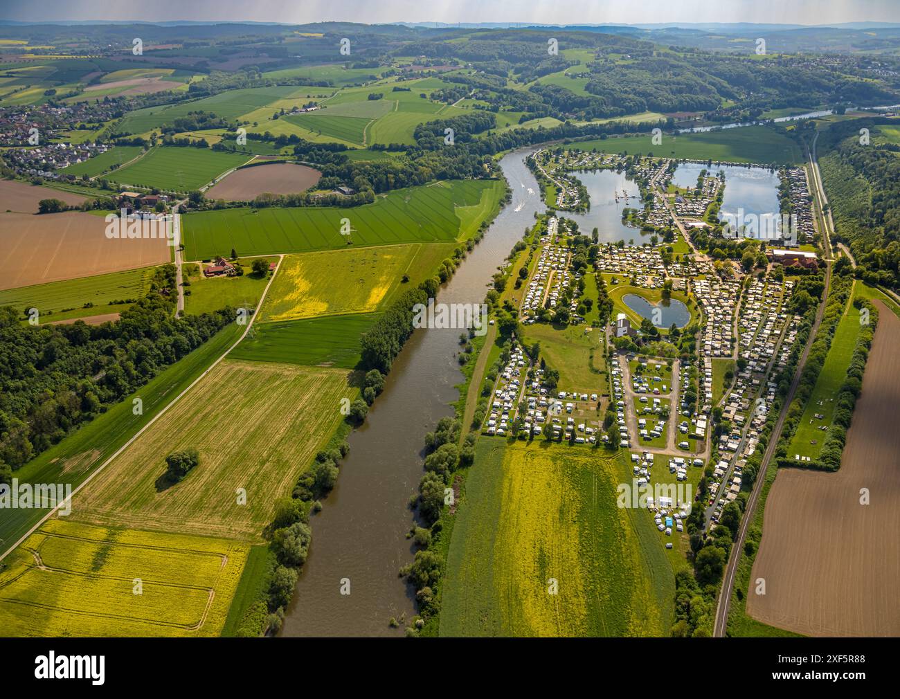 Aerial view, Camp Feuerland campsite on the River Weser, bathing lake and Weser cycle path in ...