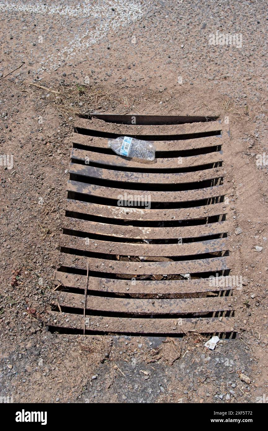 Storm water grate with debris and dirt Stock Photo - Alamy