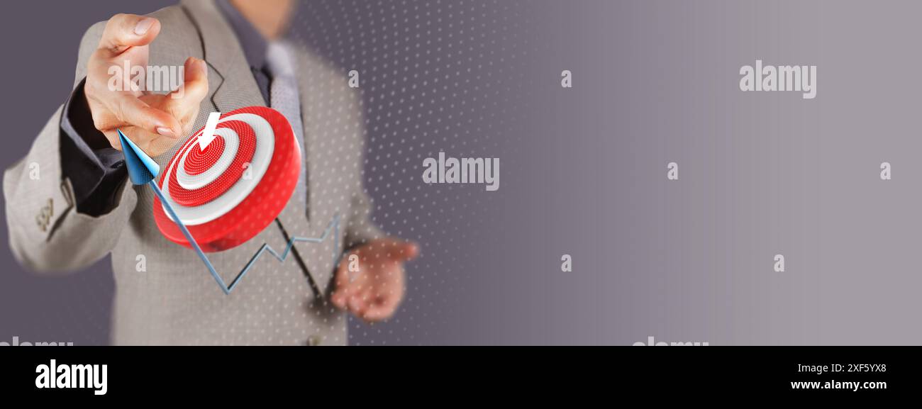 A businessman in a suit points to a digital bullseye with an arrow ...
