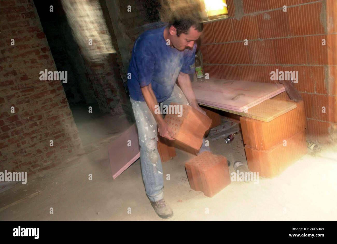 mason builds a brick wall, building work on a construction site mason ...