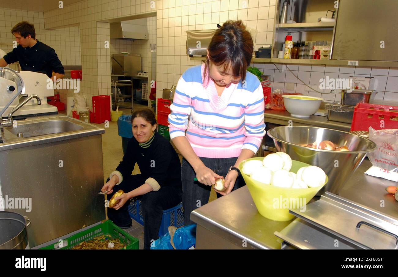 working and cooking in a catering kitchen in the field of gastronomy ...