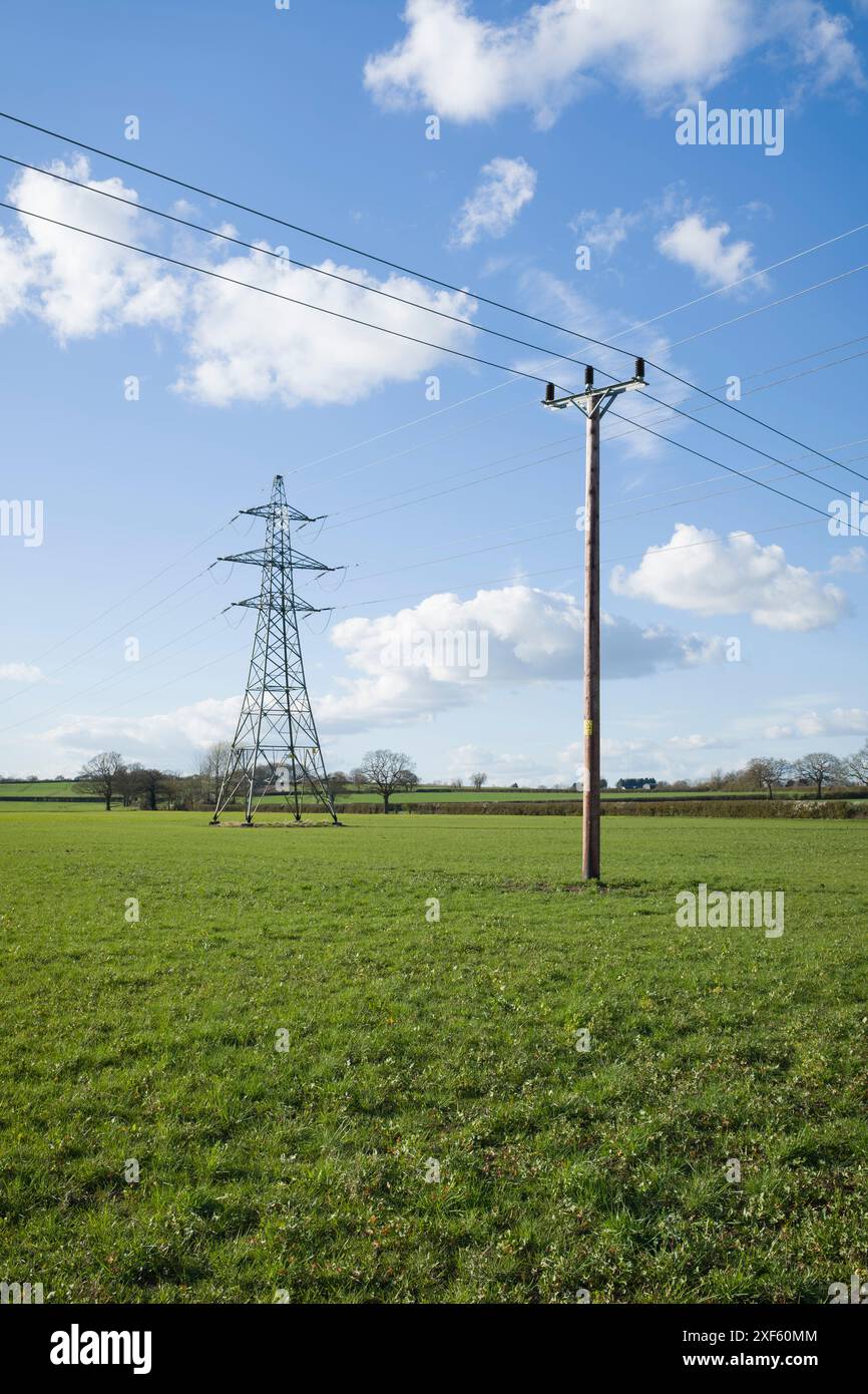 National grid electricity pylon and utility pole in UK countryside, in ...