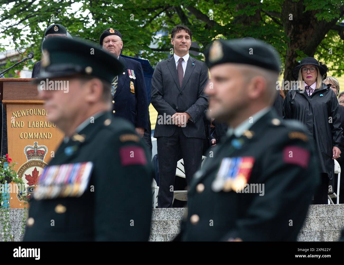 Prime Minister Justin Trudeau watches as an unknown First World War ...