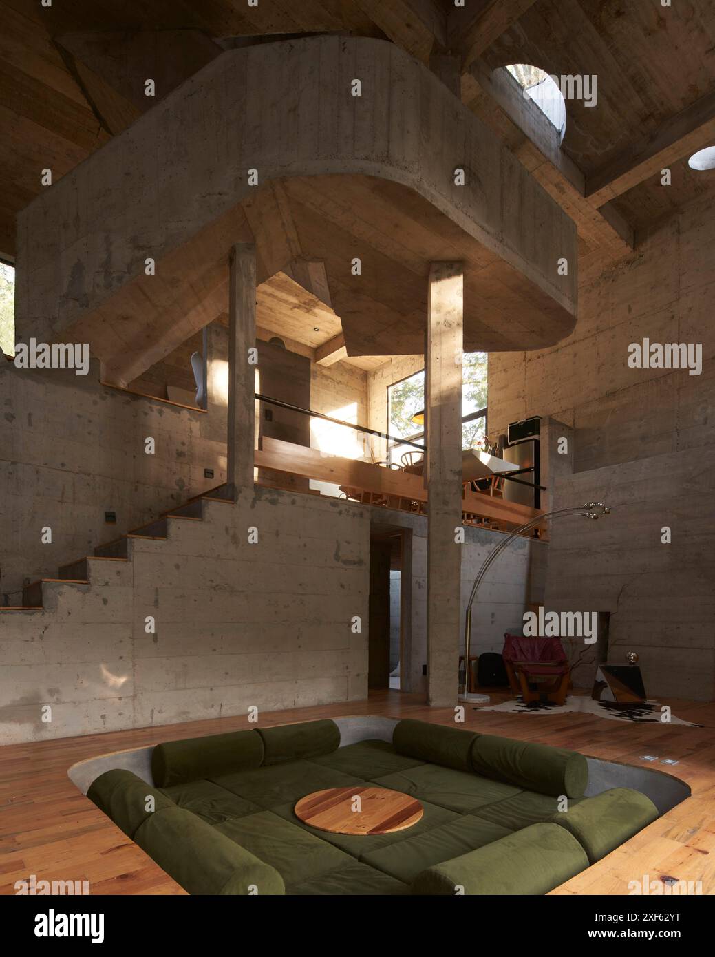 Ground floor sitting room displaying double-height space with dining ...