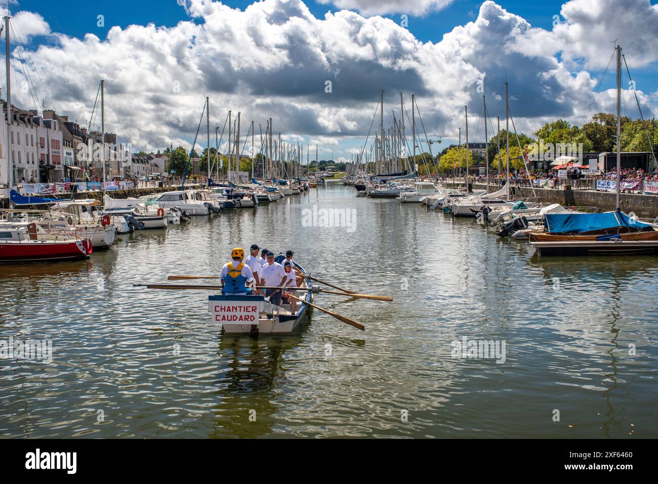 Participants row a boat during a boating event in the picturesque ...