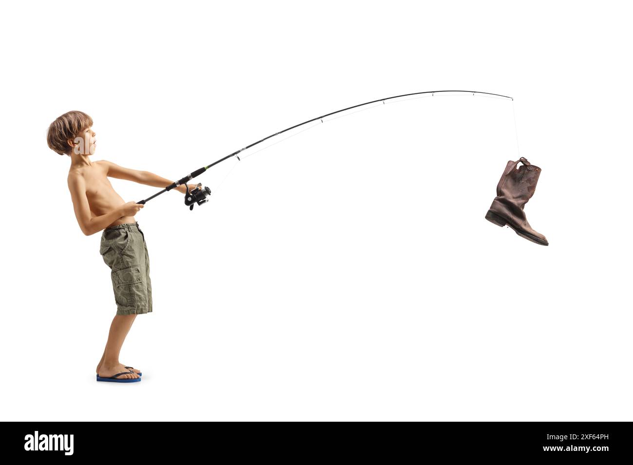Full length profile shot of a boy catching an old boot with a fishing ...