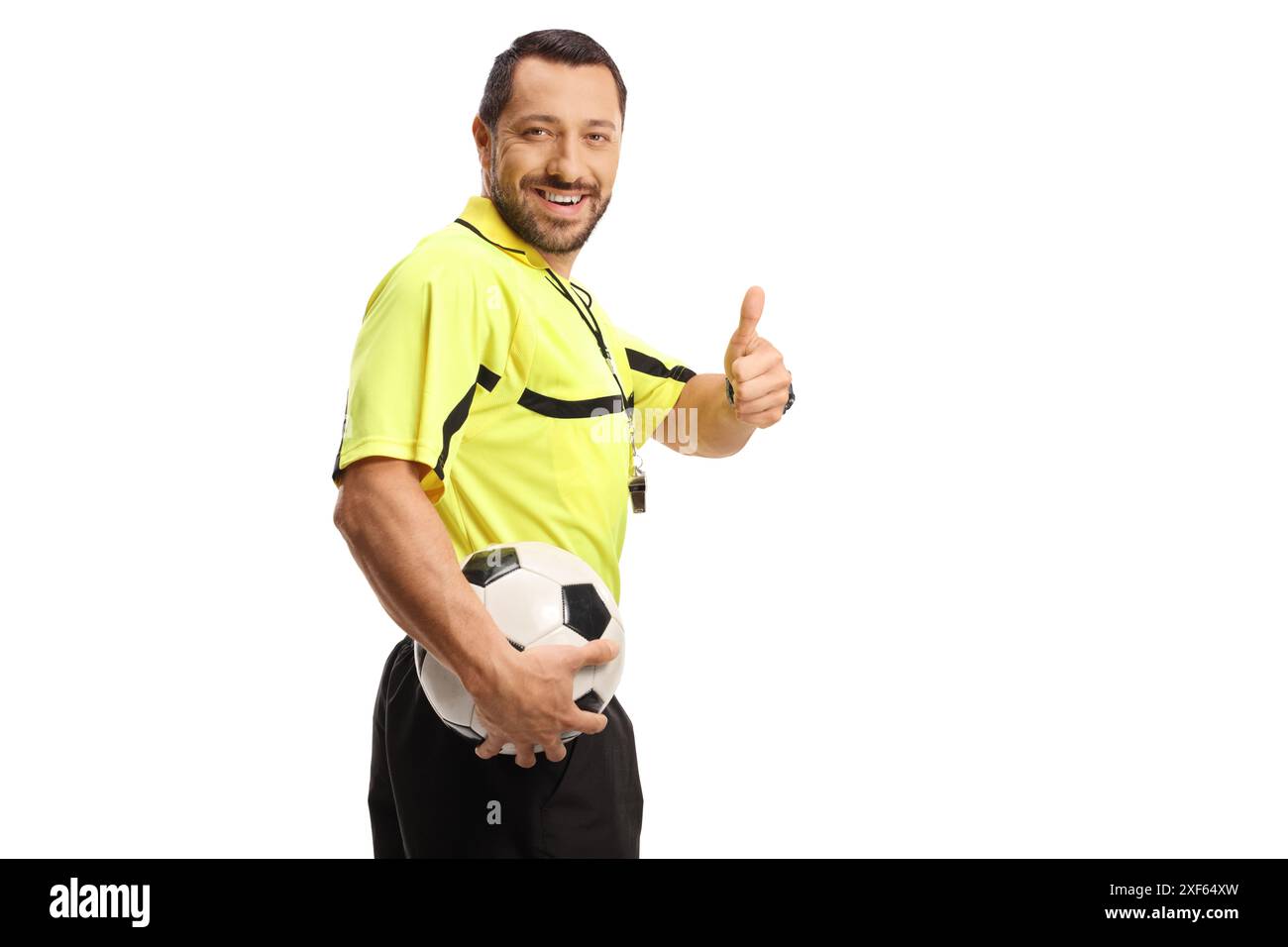 Referee holding a football and gesturing thumbs up isolated on white ...