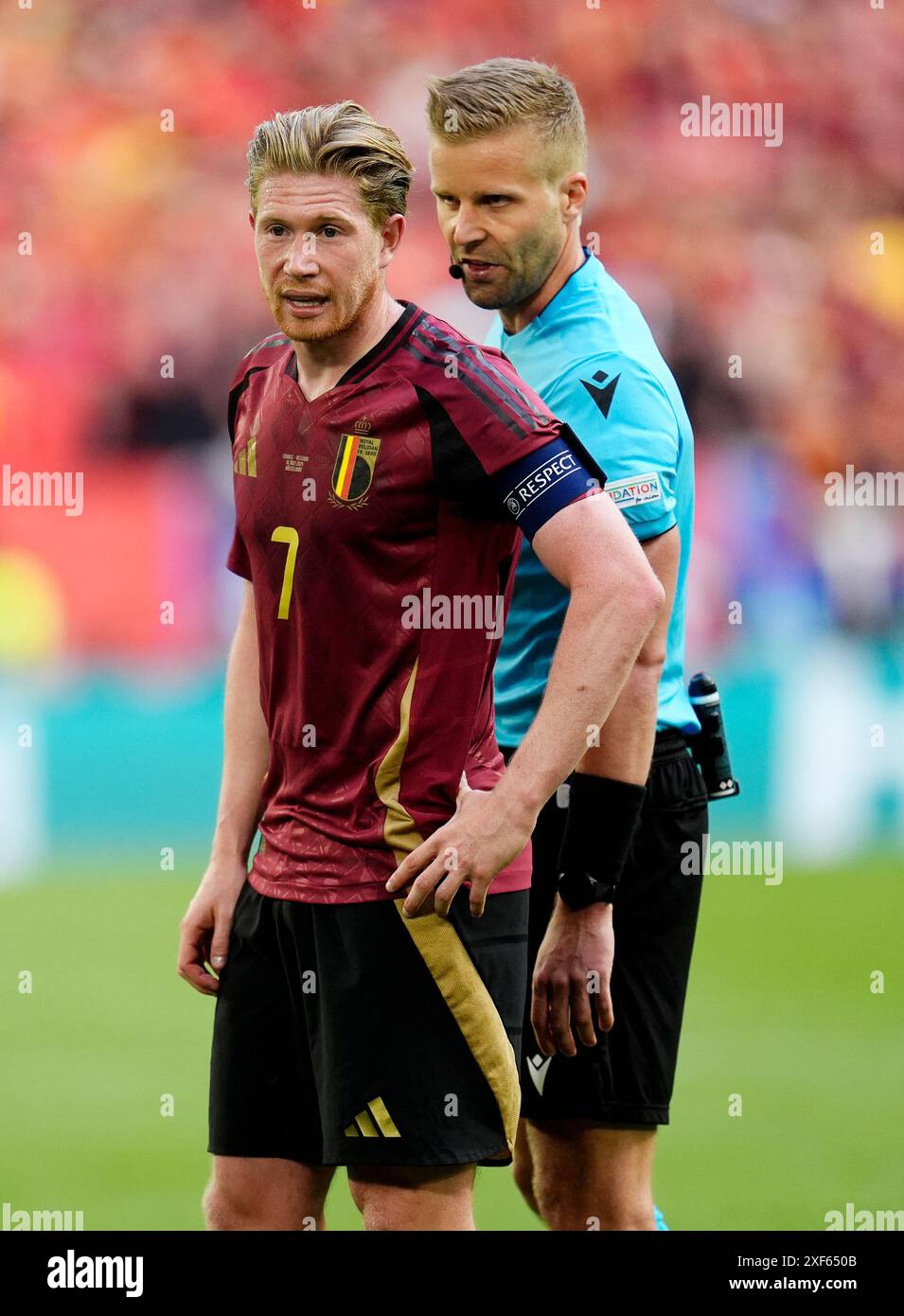 Belgium's Kevin De Bruyne (left) with referee Glenn Nyberg during the ...