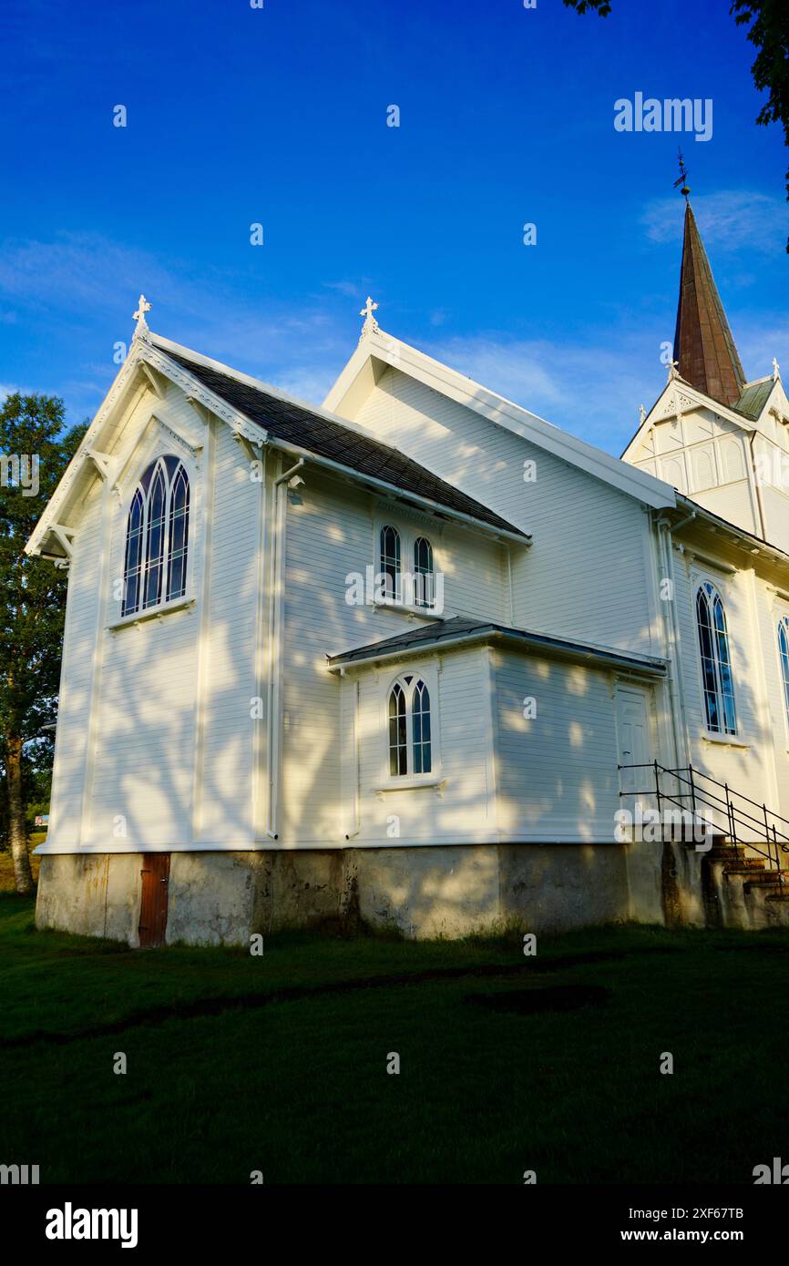A vertical footage of white wooden church with gothic windows and a ...