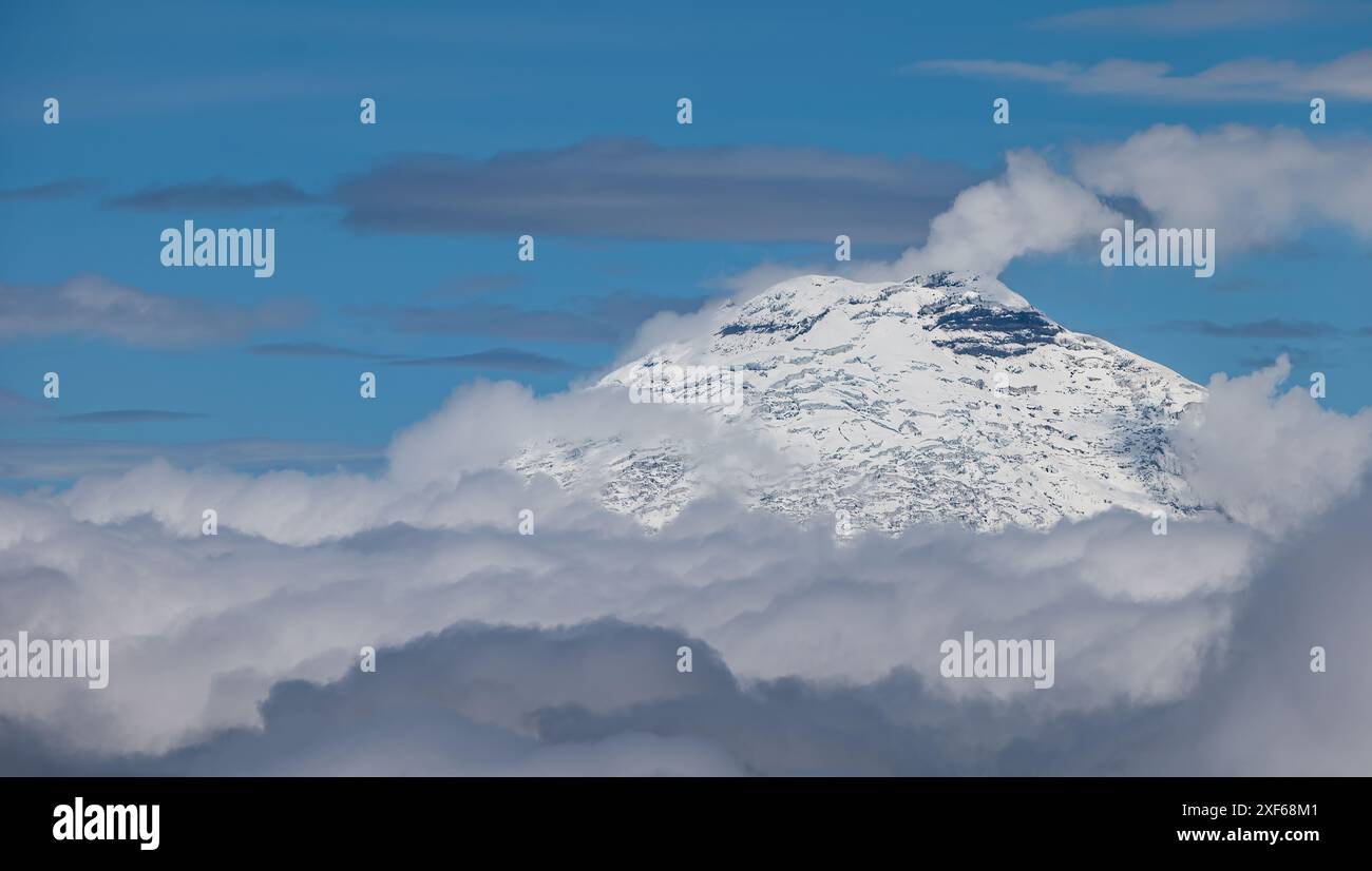 View from aeroplane window of Pichincha volcano top covered in snow ...