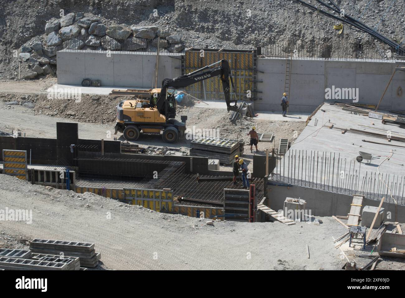 volvo excavator at a construction site, heavy machinery for earthworks ...