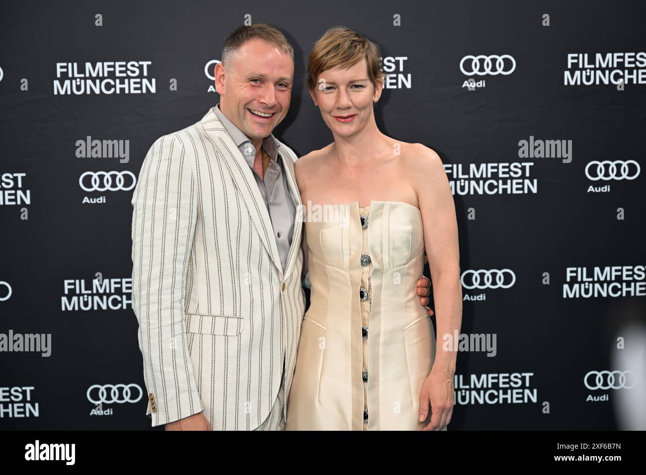 Munich, Germany. 01st July, 2024. Actors Max Riemelt (l) and Sandra Hüller pose at the photo ...