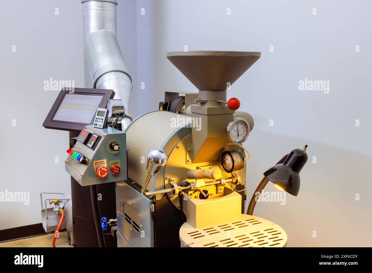 Bake raw coffee beans is made in roasting machine Stock Photo - Alamy