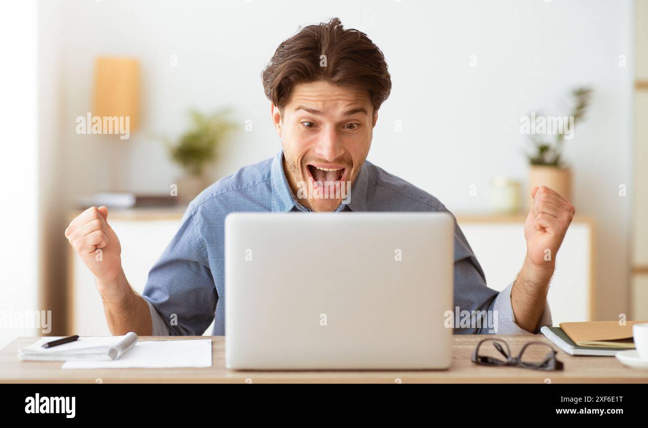 Surprised businessman celebrating success work hi-res stock photography ...