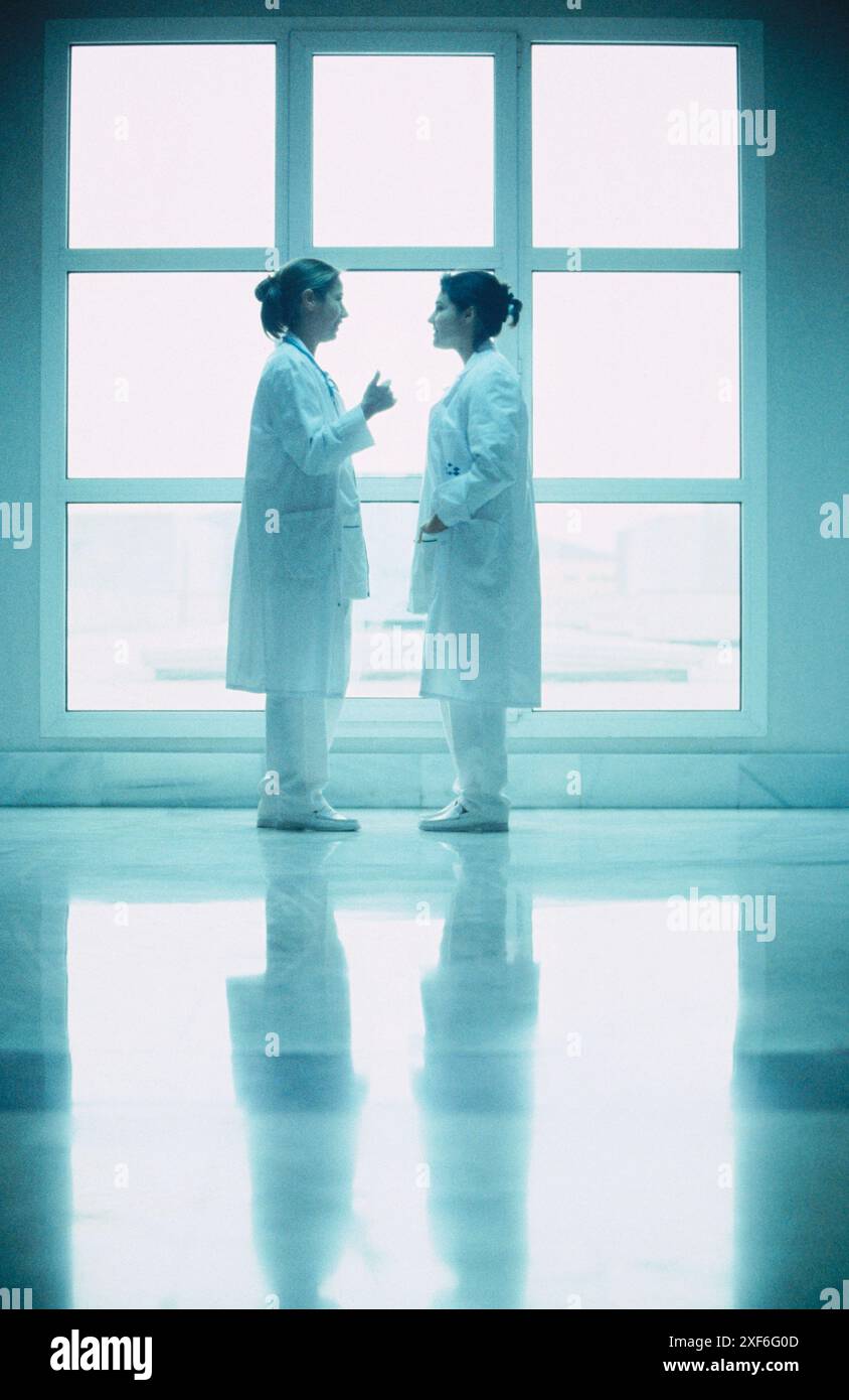 Two doctors serious conversation hi-res stock photography and images ...