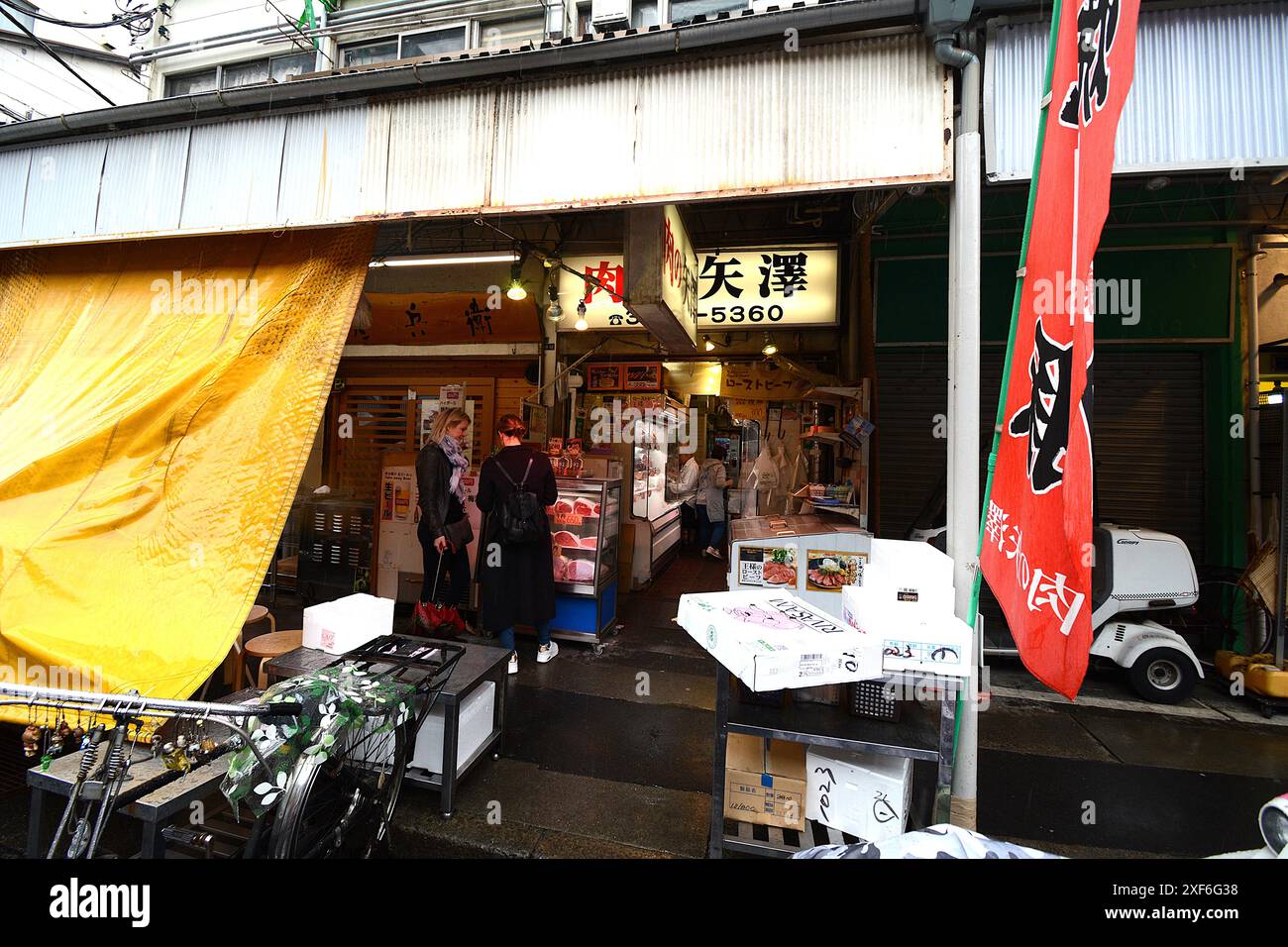 Tokyo Japan raining bad weather outside shop shops people rain cold ...