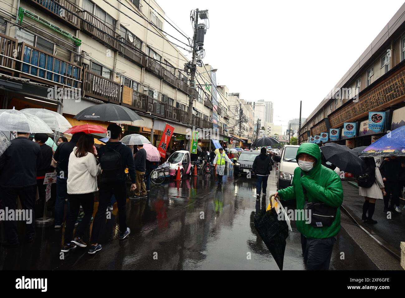 Tokyo Japan raining bad weather outside shop shops people rain cold ...