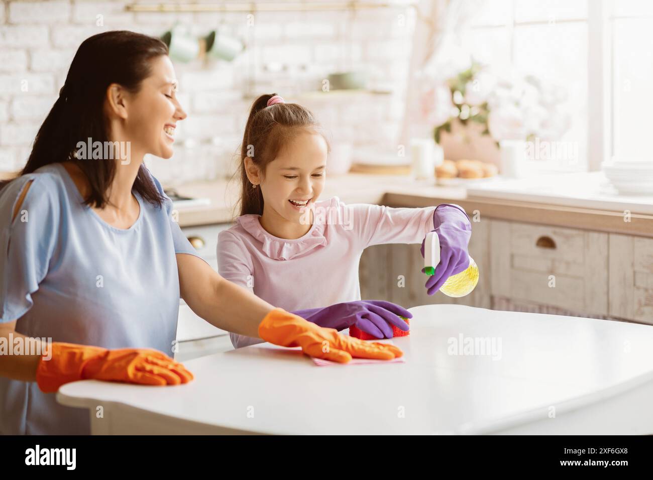 Mother and Daughter Cleaning Kitchen Table Together Stock Photo - Alamy