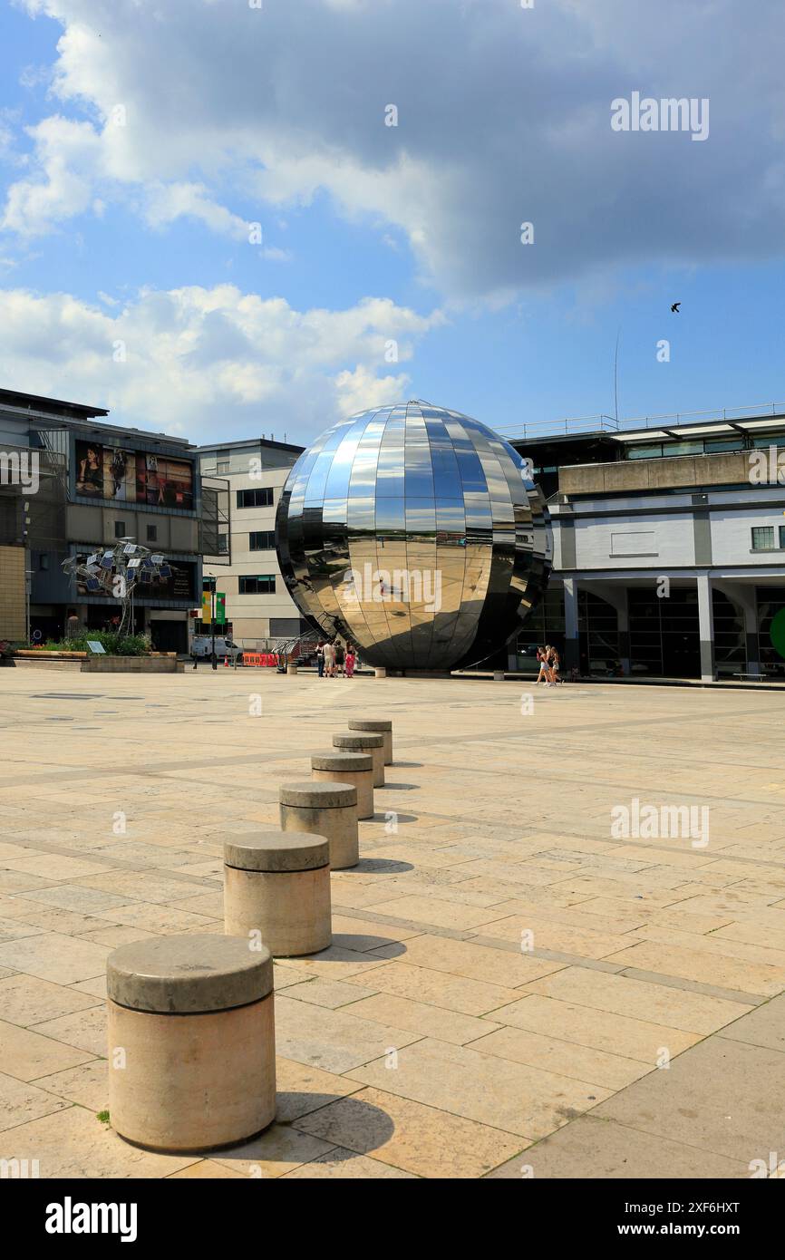 The Millennium Sphere reflecting blue sky and fluffy clouds in ...