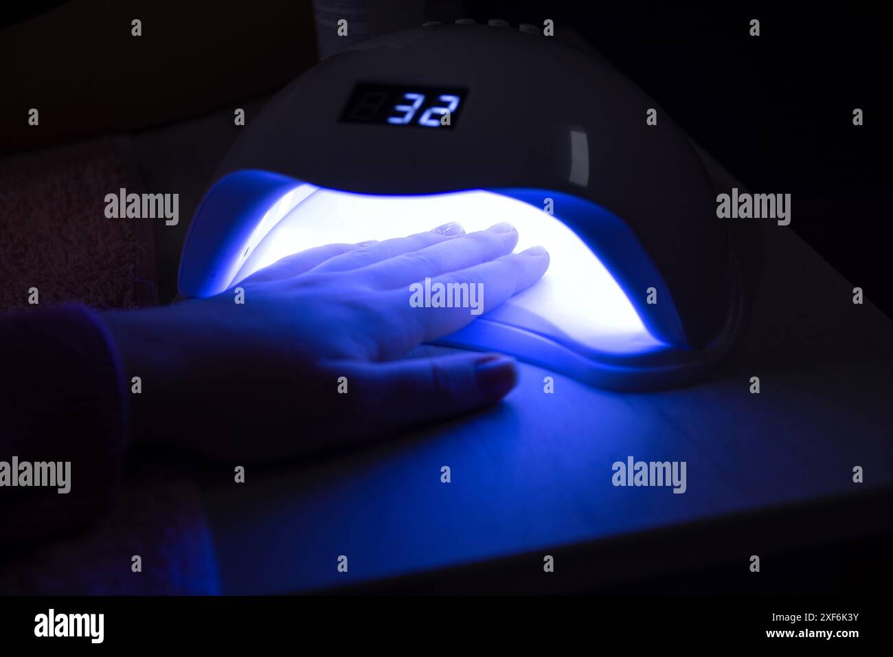 Uv lamp curing nails under hi-res stock photography and images - Alamy