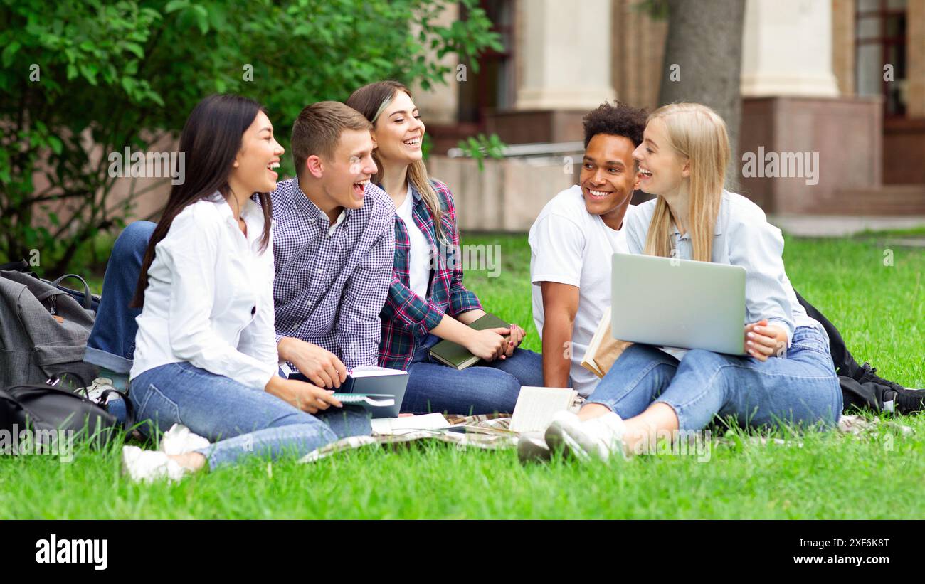 University students studying together on campus ground Stock Photo - Alamy