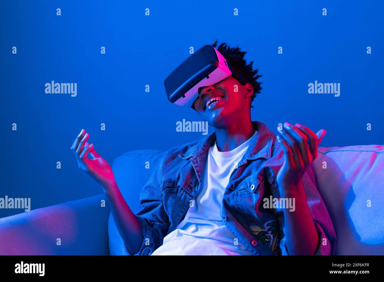 Young African American looking VR enjoy watching in scary funny ...